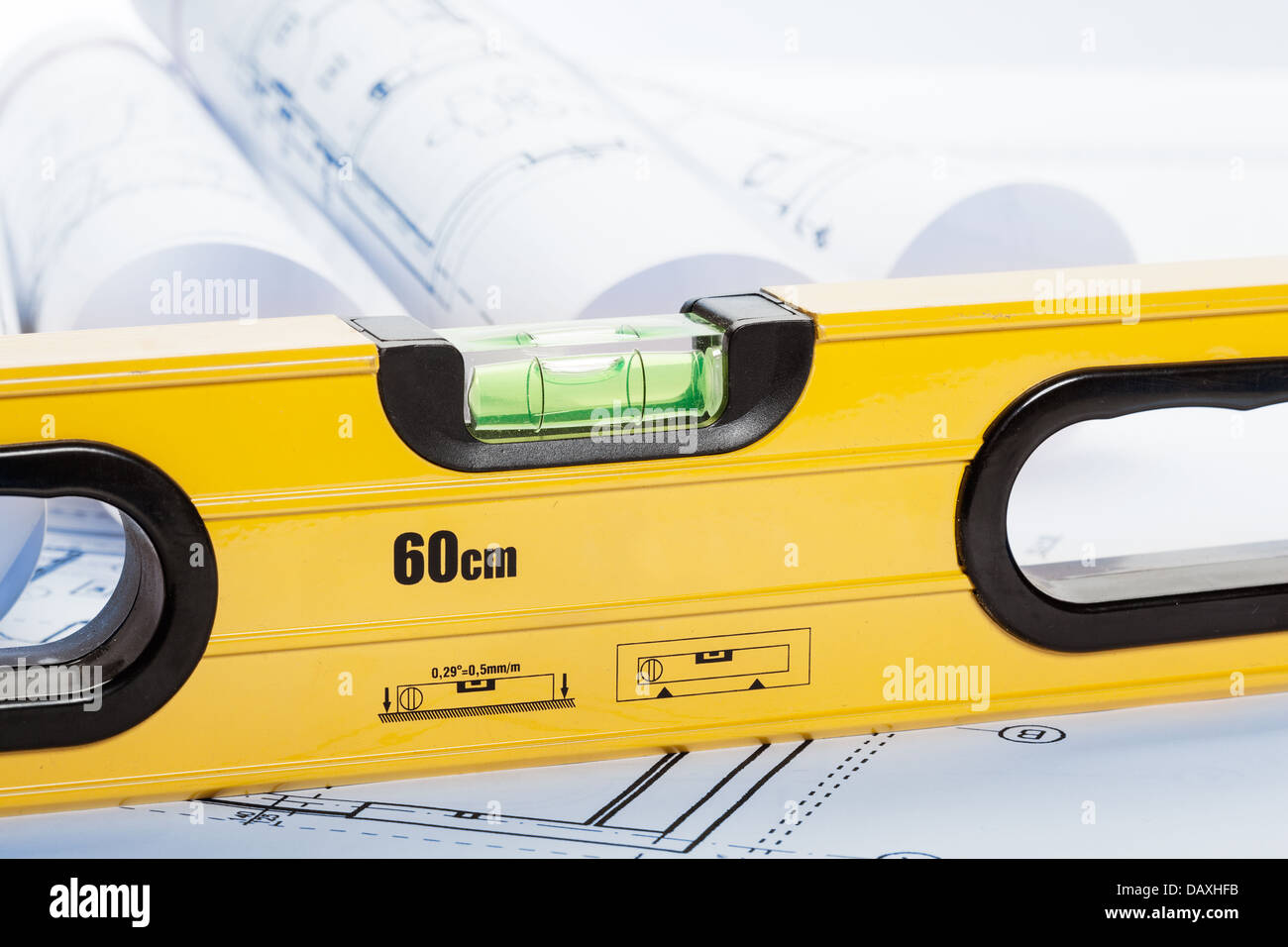 Spirit level and architecture blueprints, Blue tone Stock Photo - Alamy
