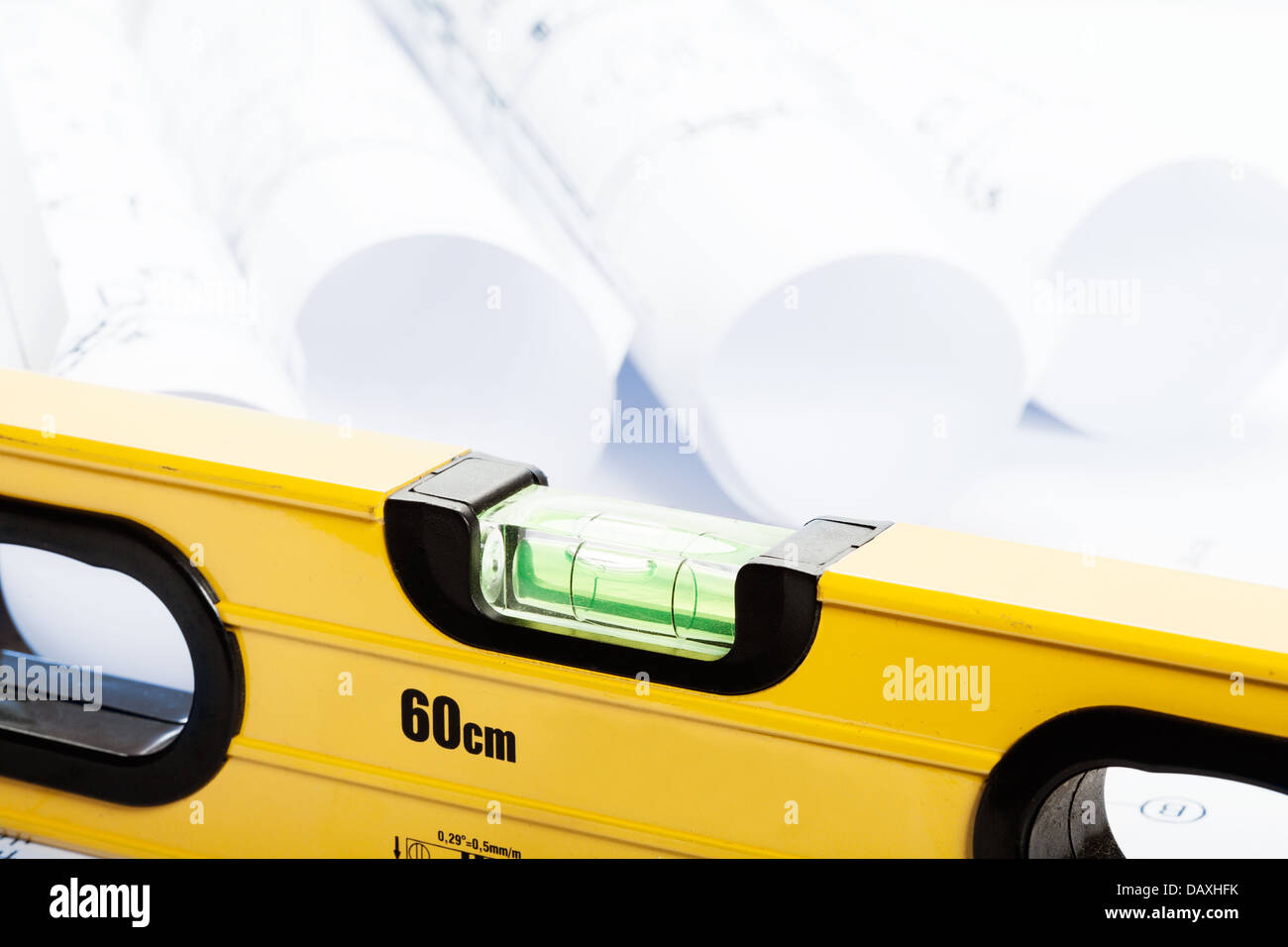Spirit level and architecture blueprints, Blue tone Stock Photo - Alamy