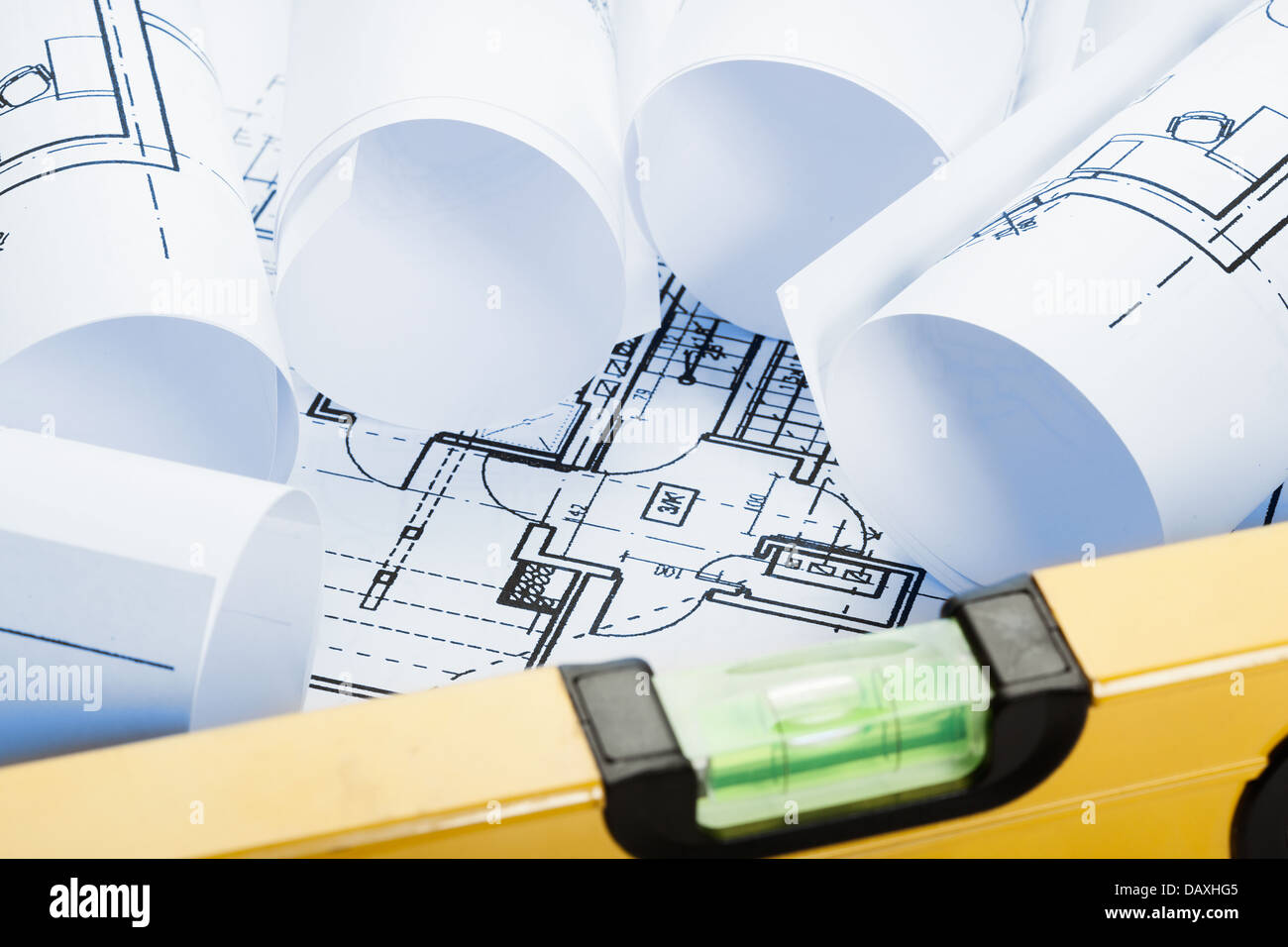 Spirit level and architecture blueprints, Blue tone Stock Photo - Alamy