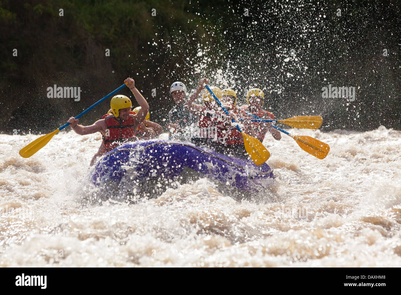 A GROUP OF MEN AND WOMEN WITH A GUIDE WHITE WATER WHITEWATER RAFTING ...