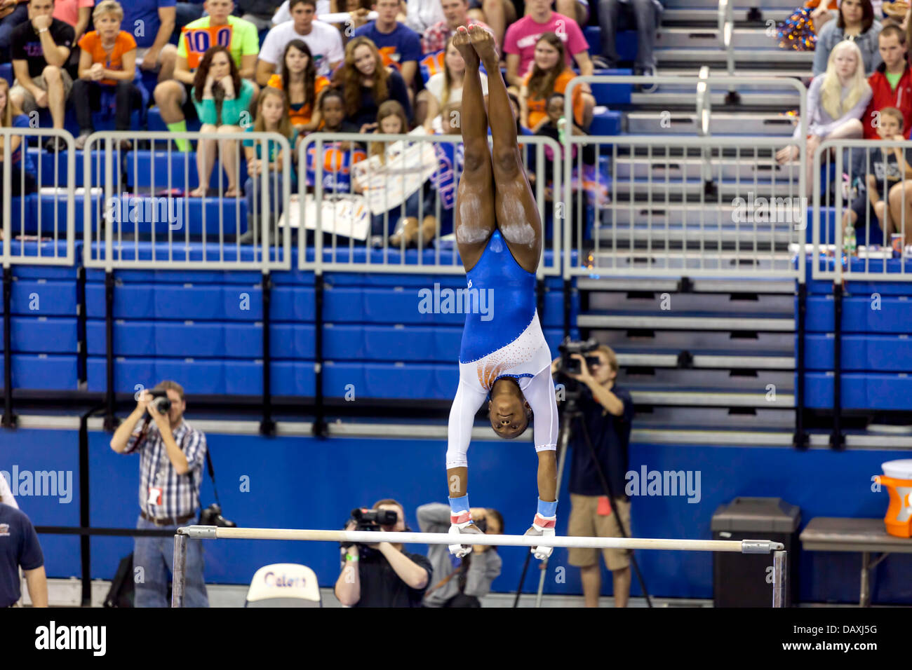 Woman competes on uneven parallel bars during Alabama Crimson Tide ...