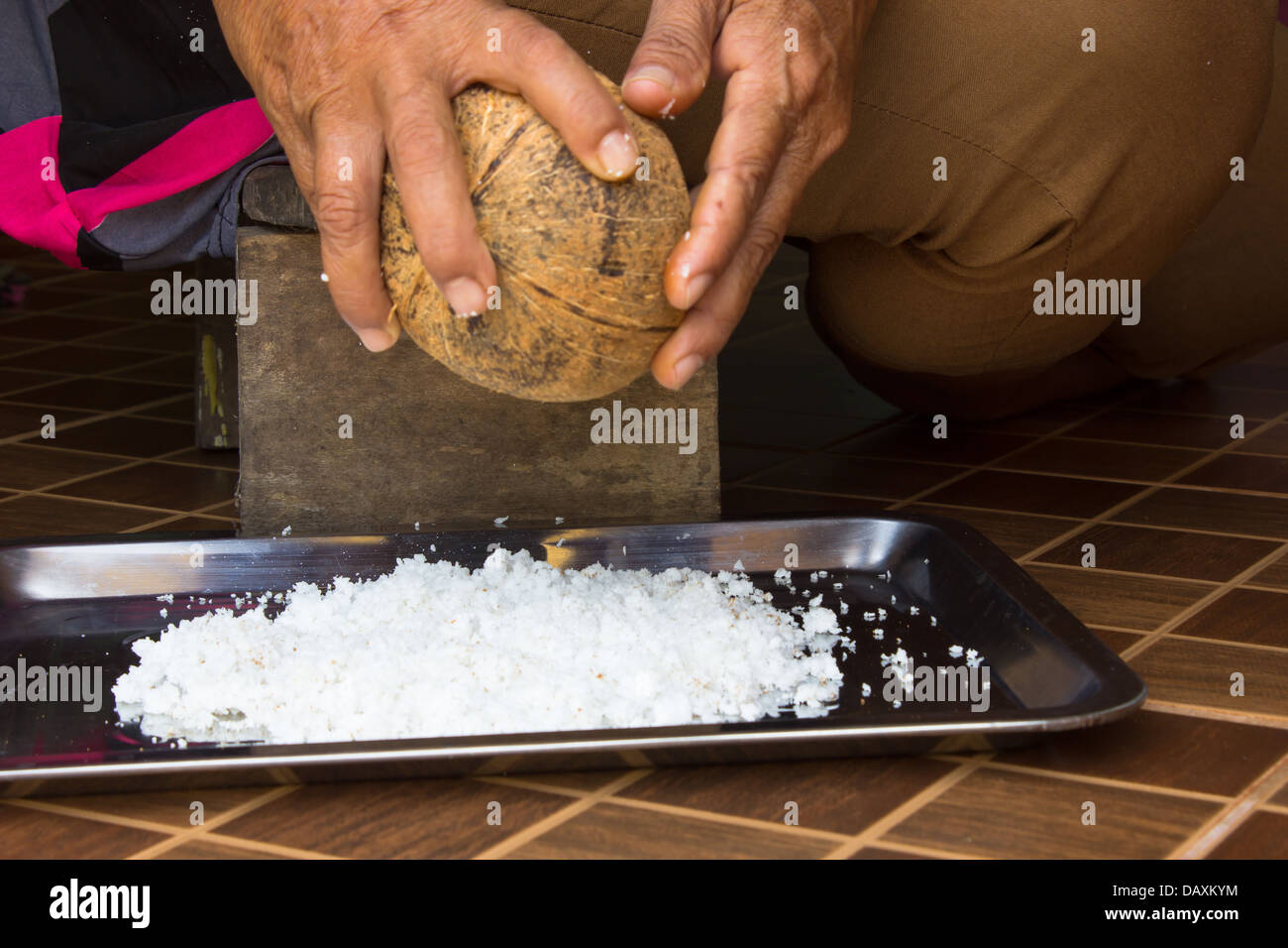 Native woman grating coconut Stock Photo - Alamy