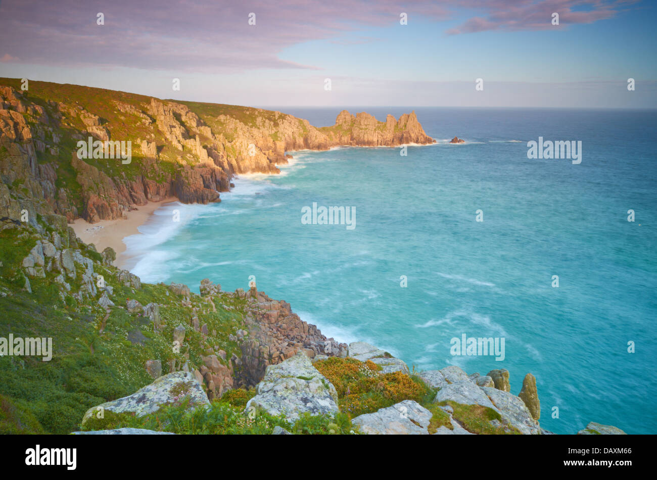Logan Rock and Pednvouder Beach from Treen Cliff near to Porthcurno in ...