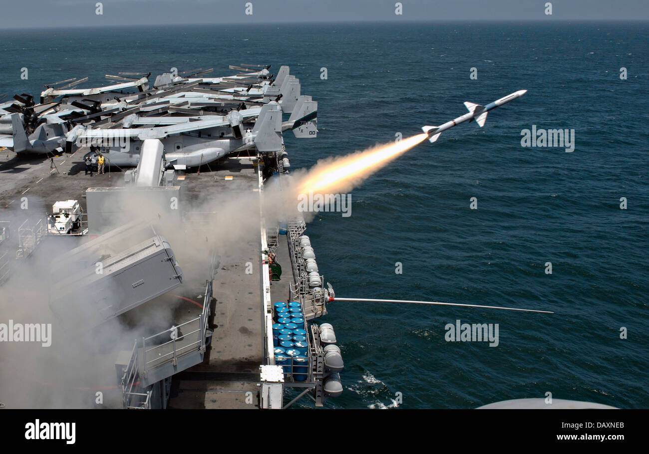 A US Navy Sea Sparrow missile is launched from the amphibious assault ...