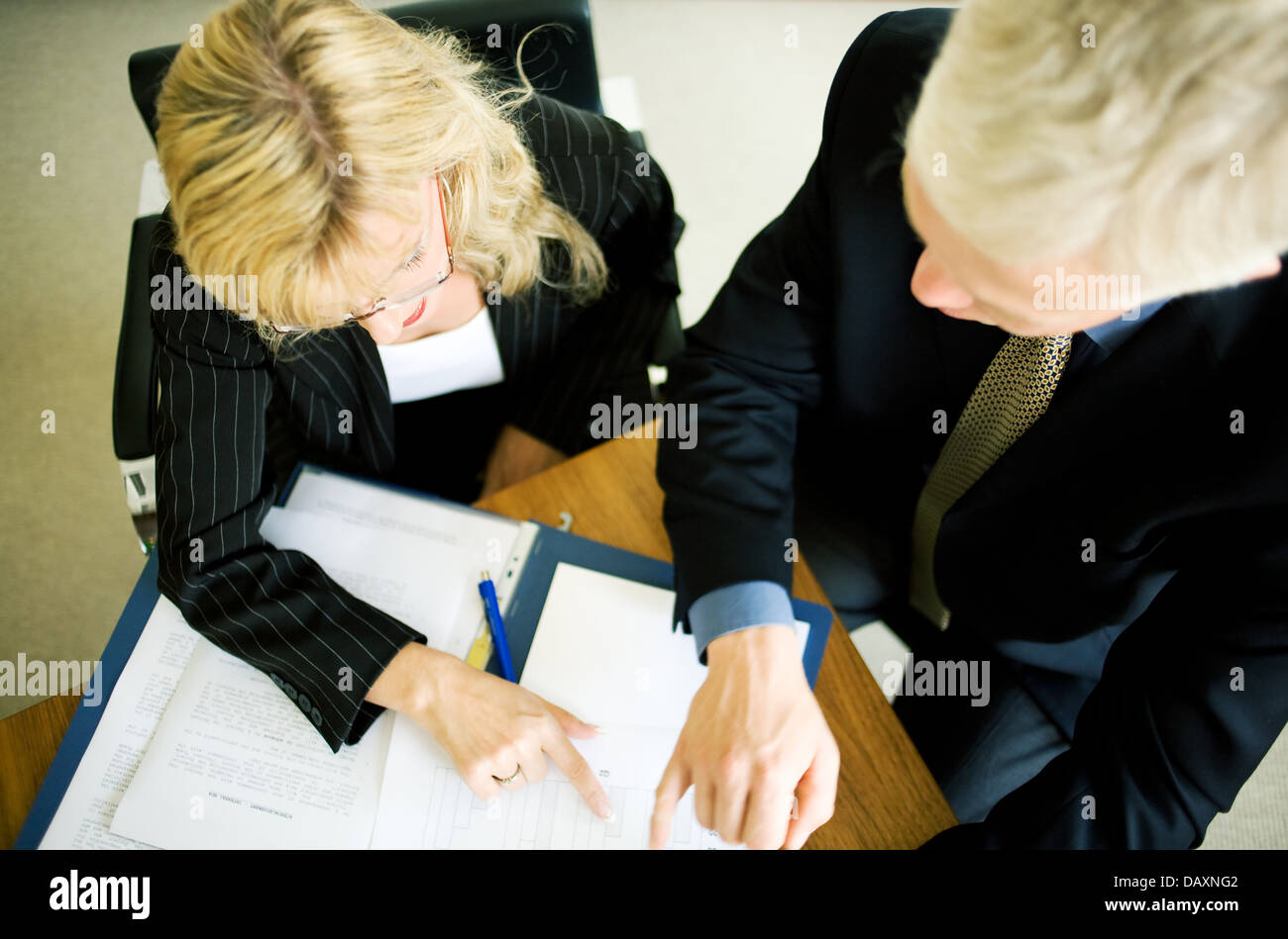 Two Executives discussing documents (very shallow depth of field Stock ...