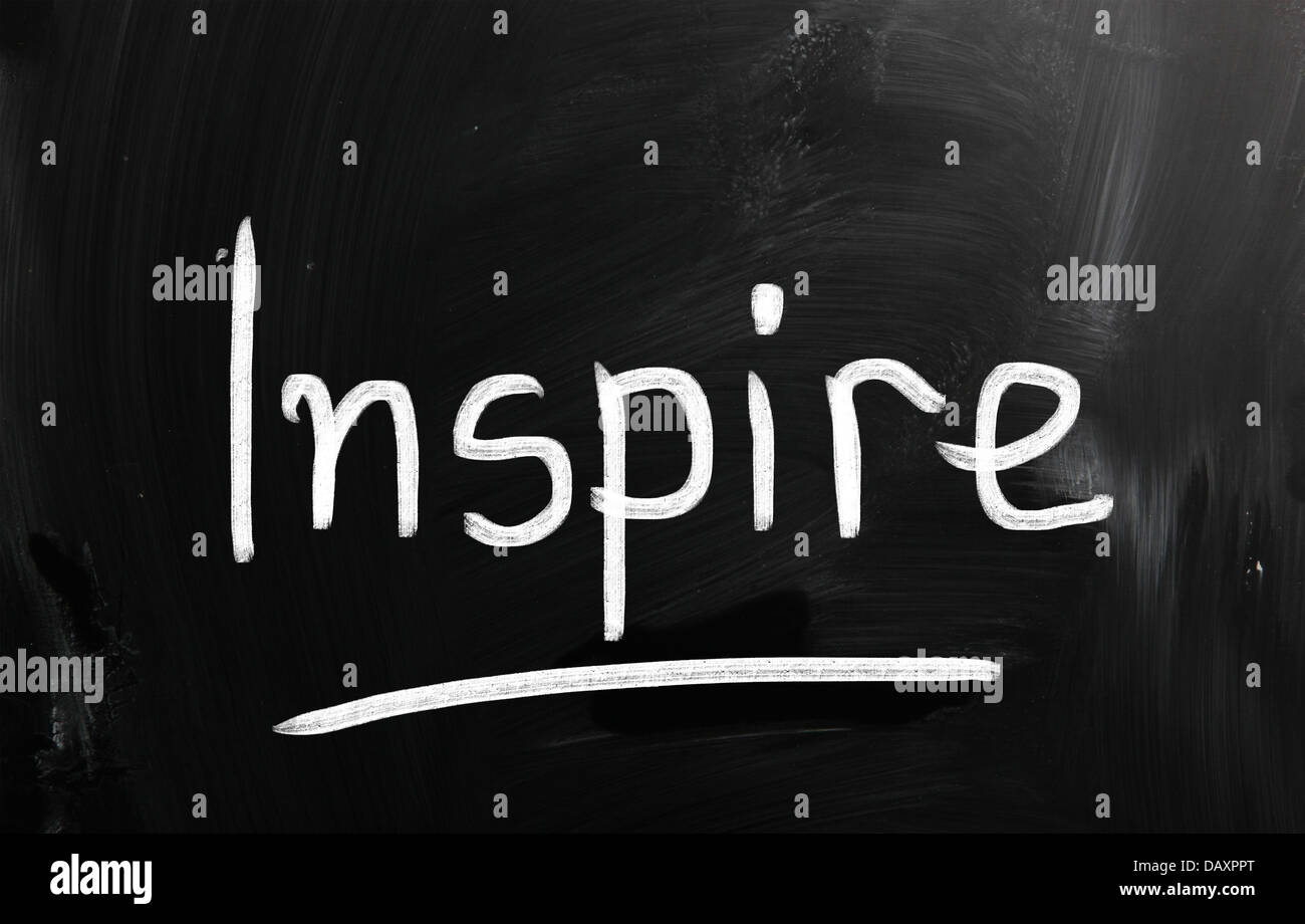 Inspire handwritten with white chalk on a blackboard Stock Photo - Alamy