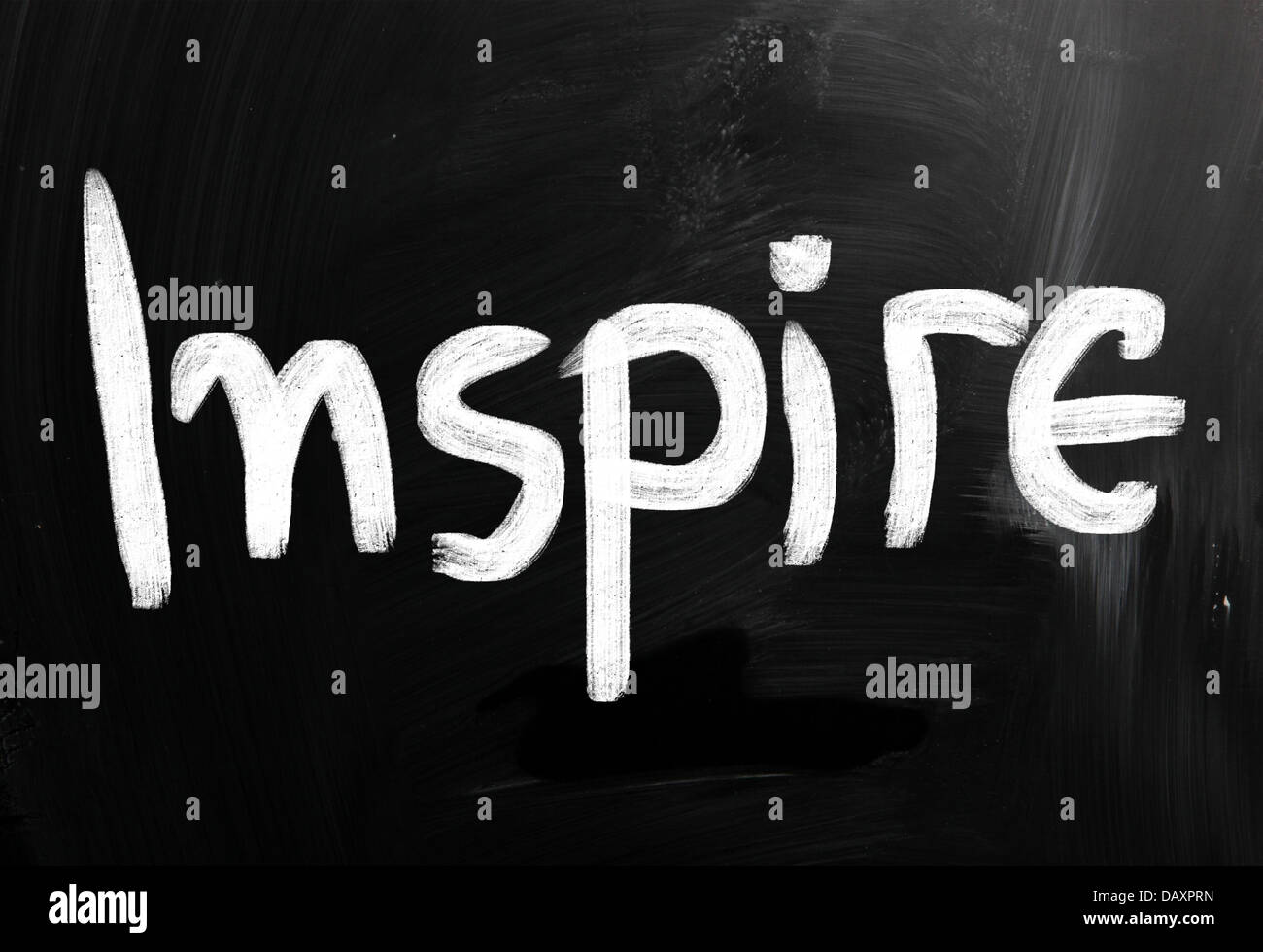 Inspire handwritten with white chalk on a blackboard Stock Photo - Alamy