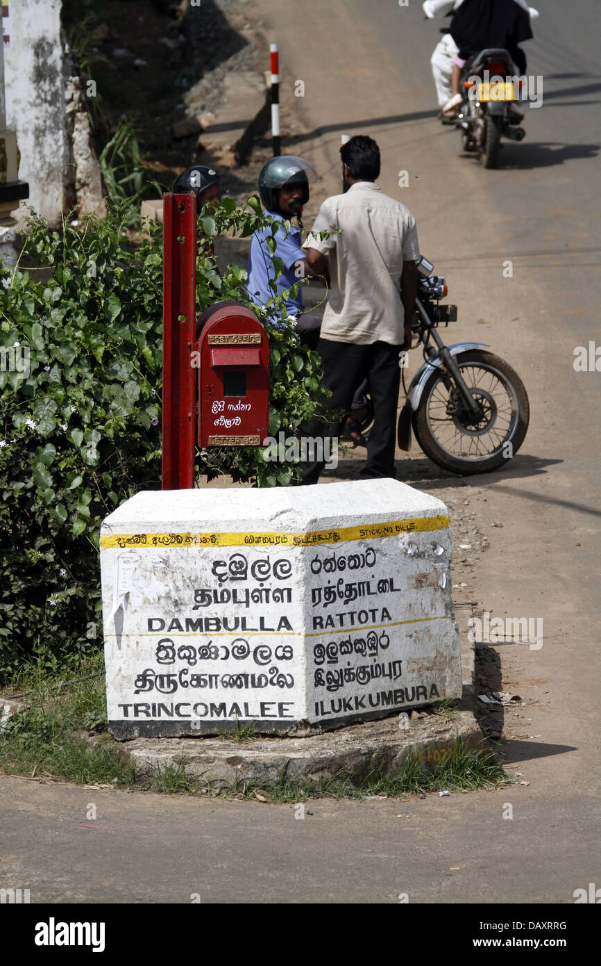 ROAD SIGN & RED POST BOX MATALE SRI LANKA 11 March 2013 Stock Photo - Alamy