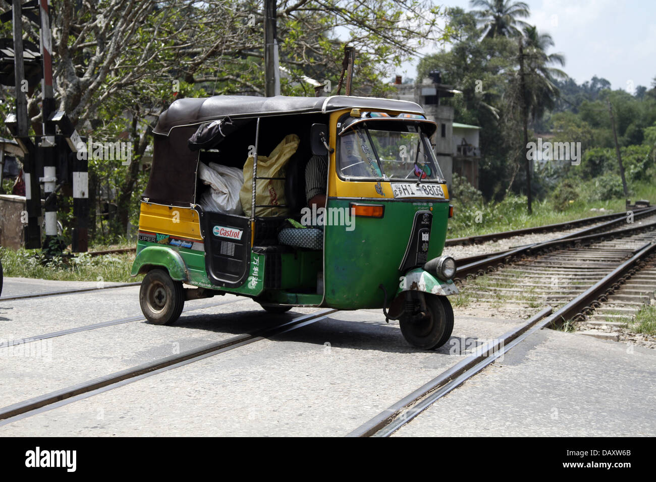 TUC TUC CROSSES RAILWAY TRACK PERADENIYA SRI LANKA 12 March 2013 Stock ...