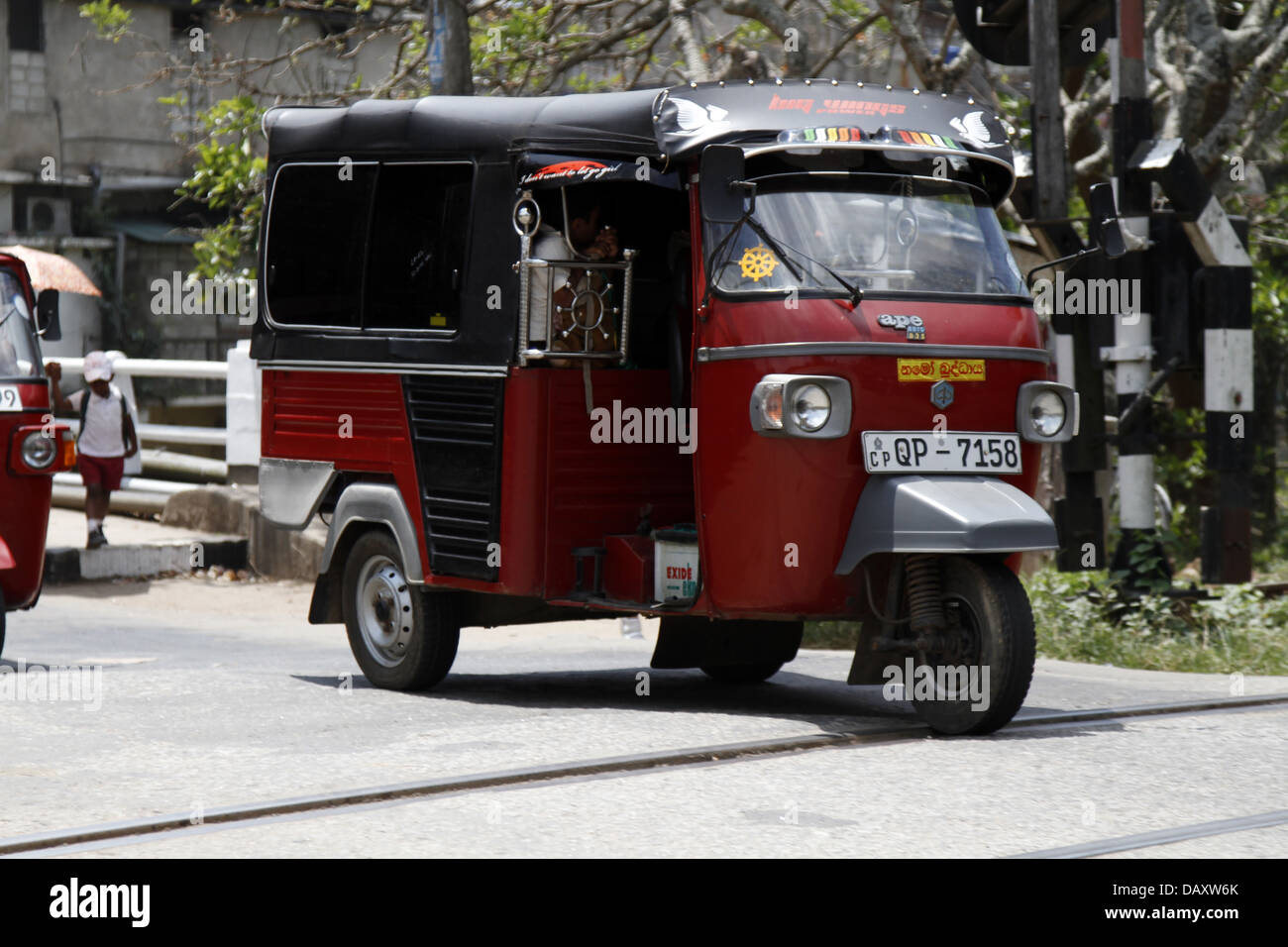 TUC TUC CROSSES RAILWAY TRACK PERADENIYA SRI LANKA 12 March 2013 Stock ...