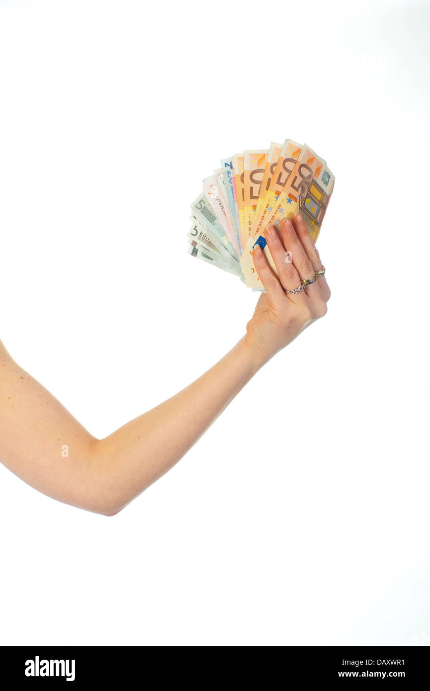 a woman's hand holding several banknotes Stock Photo - Alamy