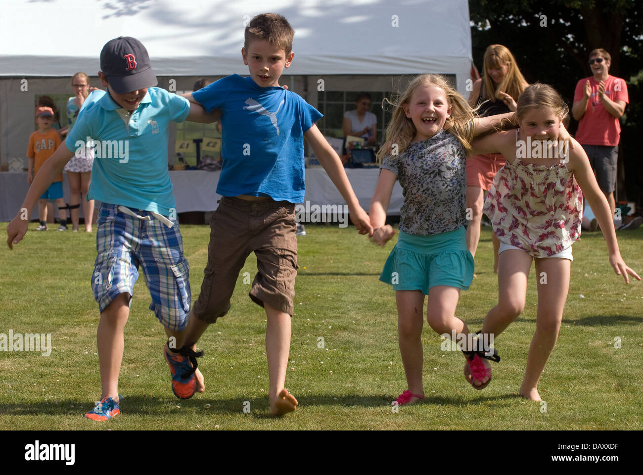 Youngsters taking part in a two-legged race at Worldham Village Fete ...