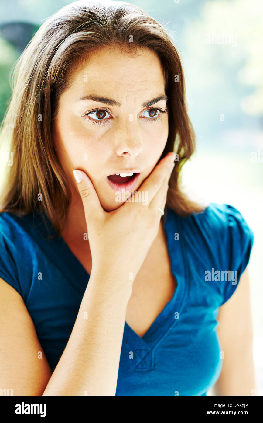 Woman looking shocked Stock Photo - Alamy