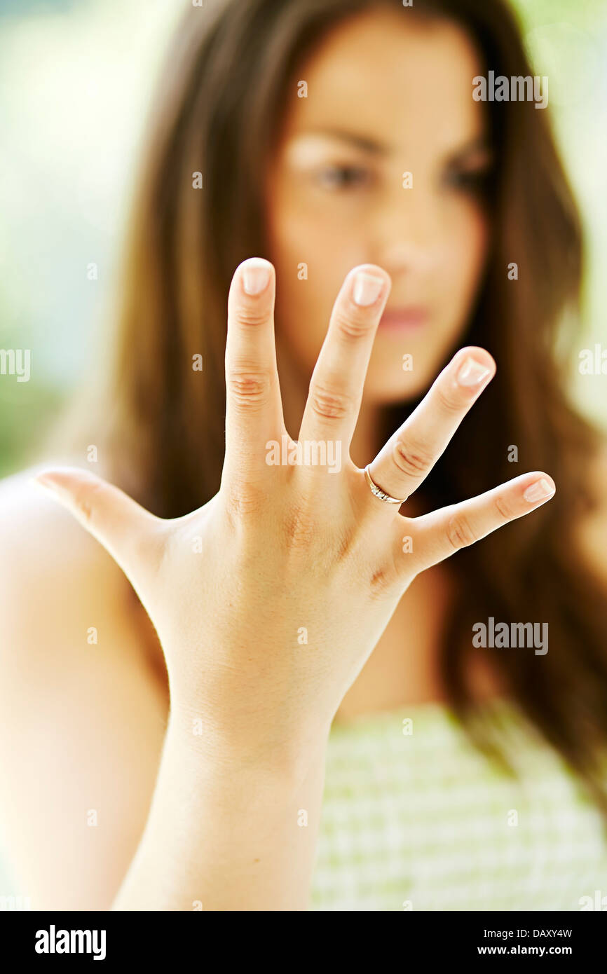 Woman using hands to explain things Stock Photo - Alamy