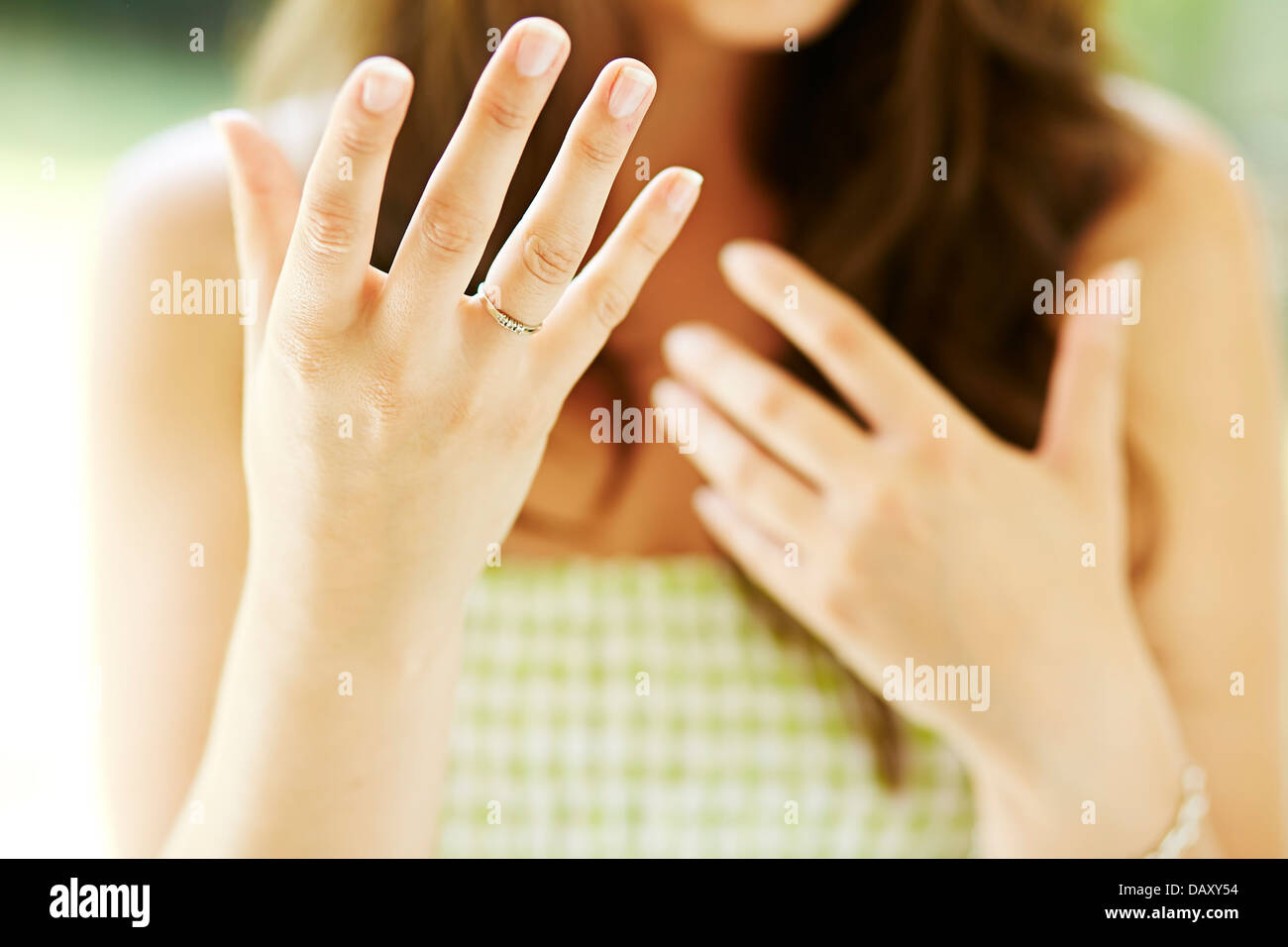 Woman using hands to explain things Stock Photo - Alamy