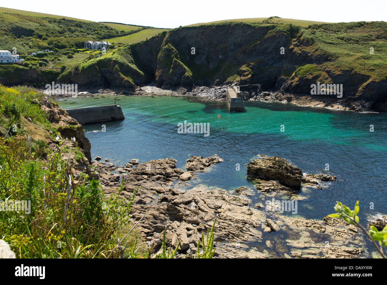 Harbour walls with blue sea in Cornwall England UK a beautiful sunny ...