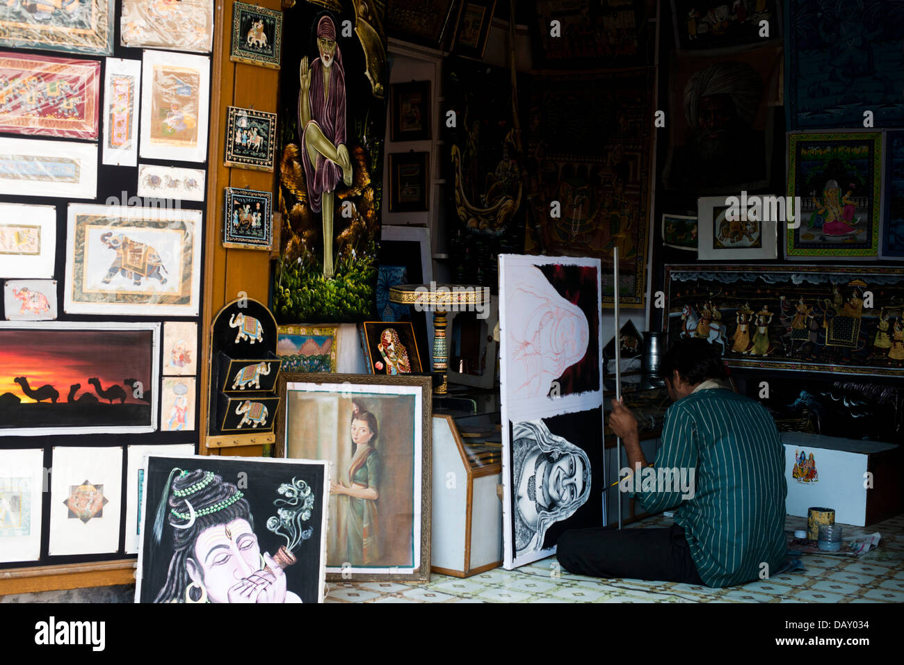 Local Artist painting canvas pictures which are sold to tourists ...