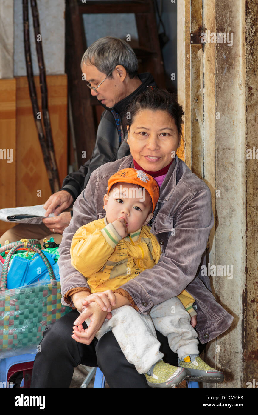 A small Vietnamese family at their street shop in Hanoi, Vietnam, Asia ...