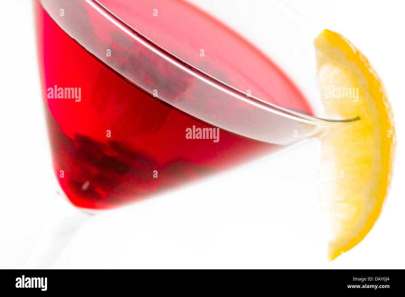 Pomegranate cosmo cocktail with lemon as a garnish Stock Photo - Alamy