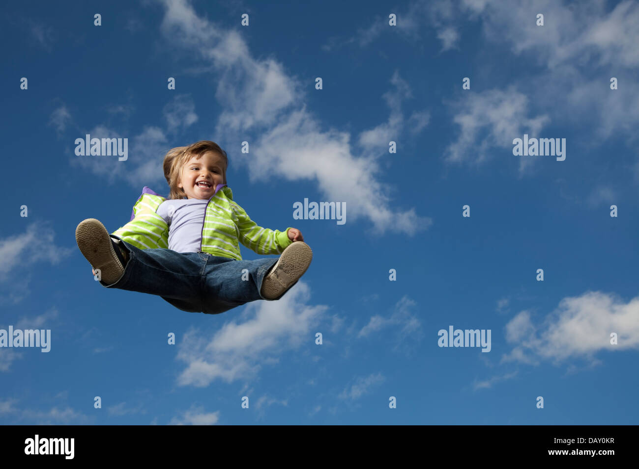 Two years old girl flying in the sky Stock Photo - Alamy
