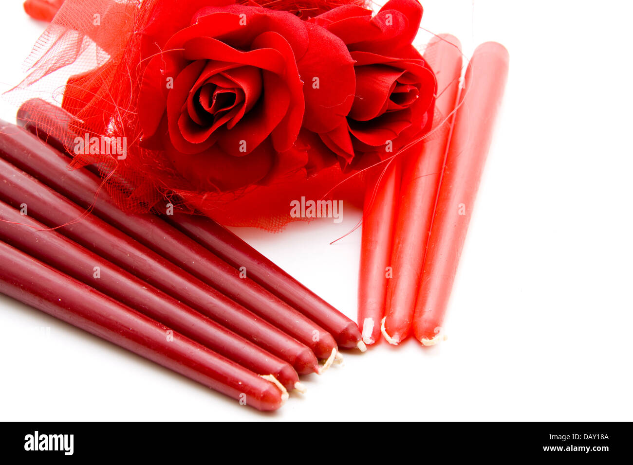 Long table candles with roses Stock Photo - Alamy