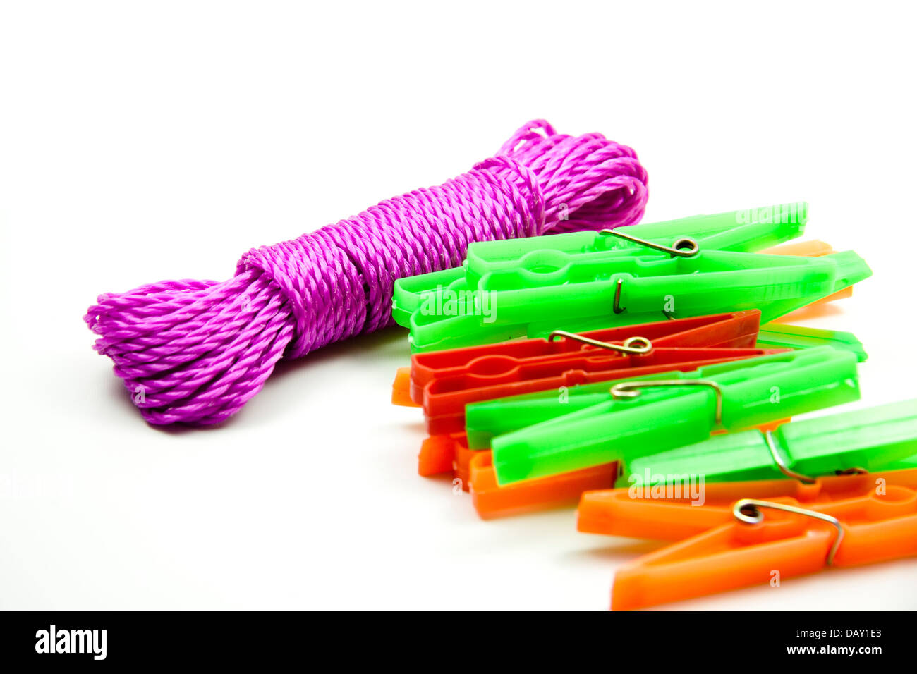 Plastic clips with clothesline Stock Photo - Alamy