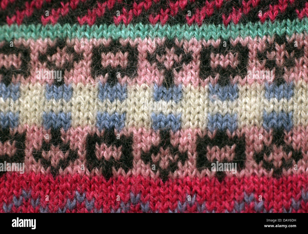 Pink knitted wool pattern background in Fair Isle style Stock Photo - Alamy