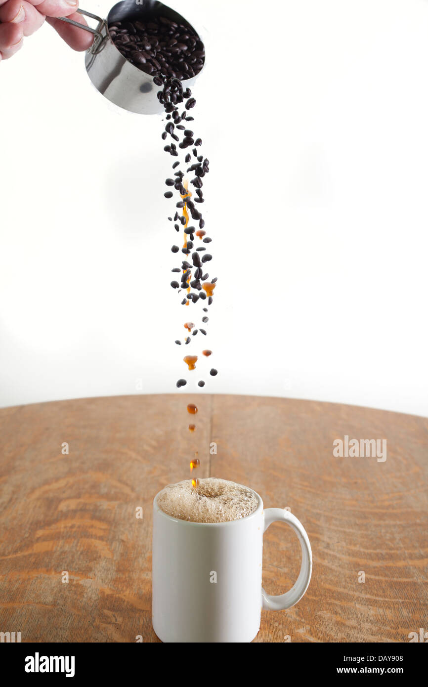 Coffee beans pouring and magically turning into liquid coffee into a ...