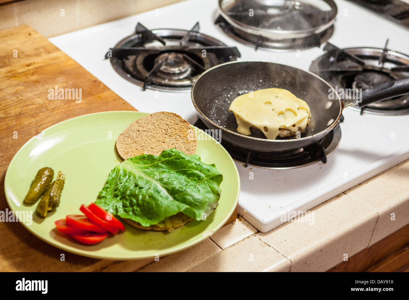 A luscious turkey hamburger with low fat swiss cheese and thin bread ...