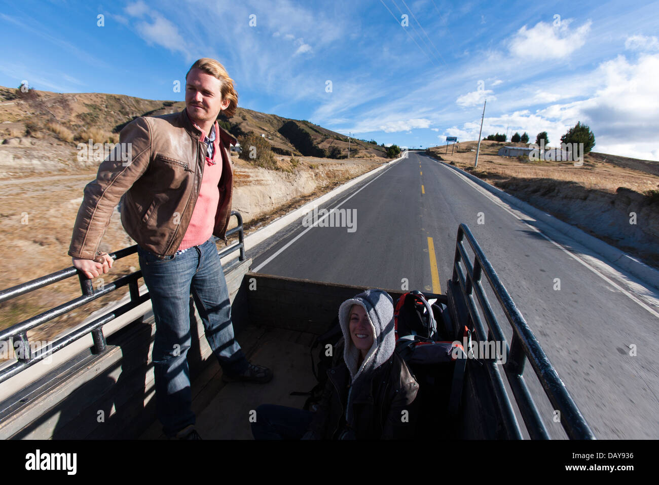 Two tourists or backpackers take a pick up truck, public transport ...