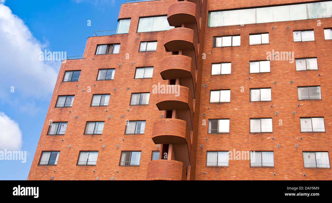 Orange building for a residence and business Stock Photo - Alamy
