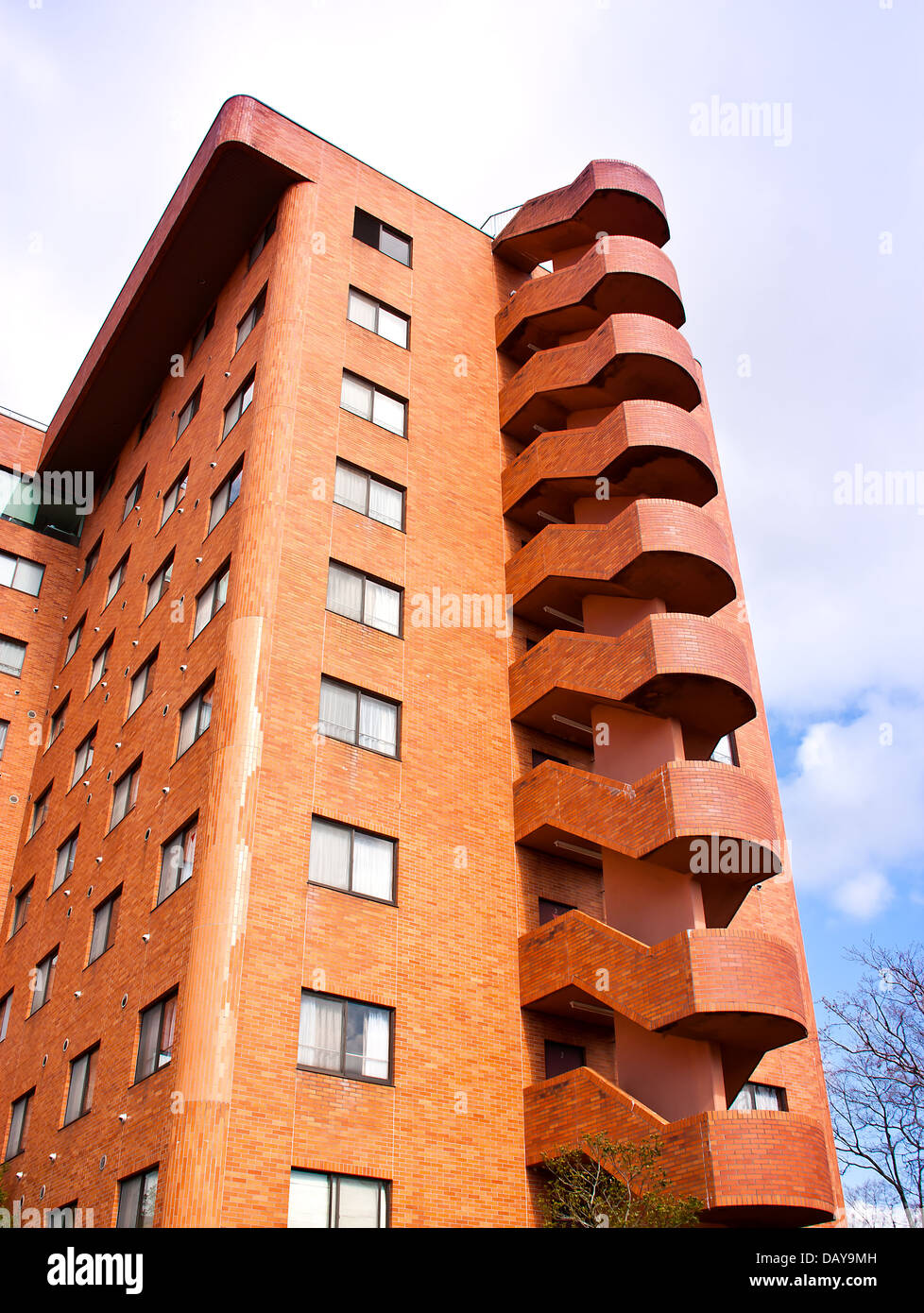 Orange building for a residence and business Stock Photo - Alamy