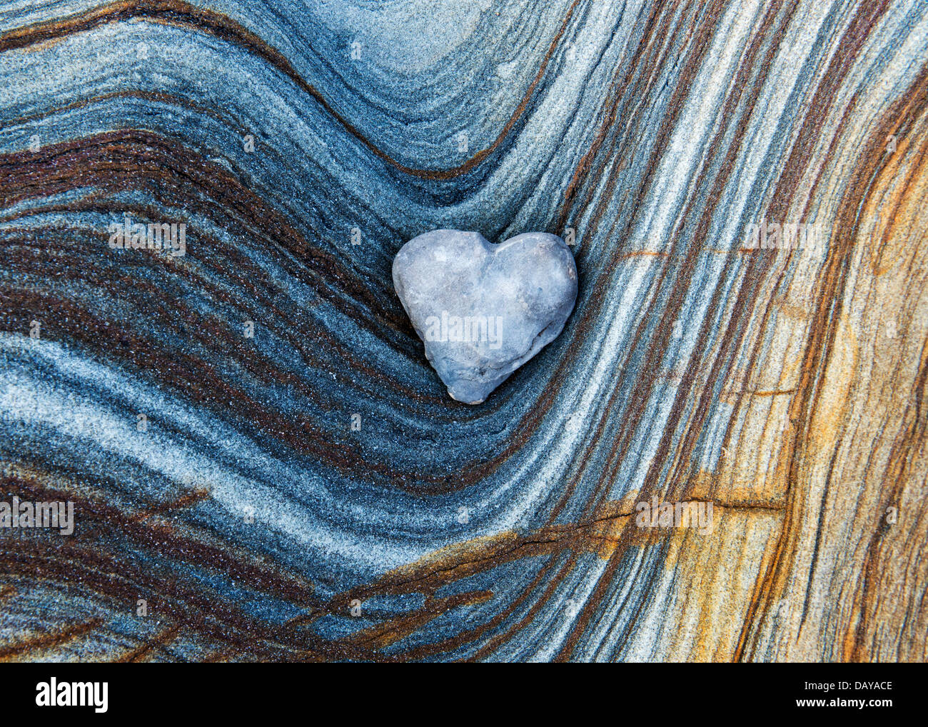 Heart shape pebble on Sandstone rock strata pattern. Northumberland ...
