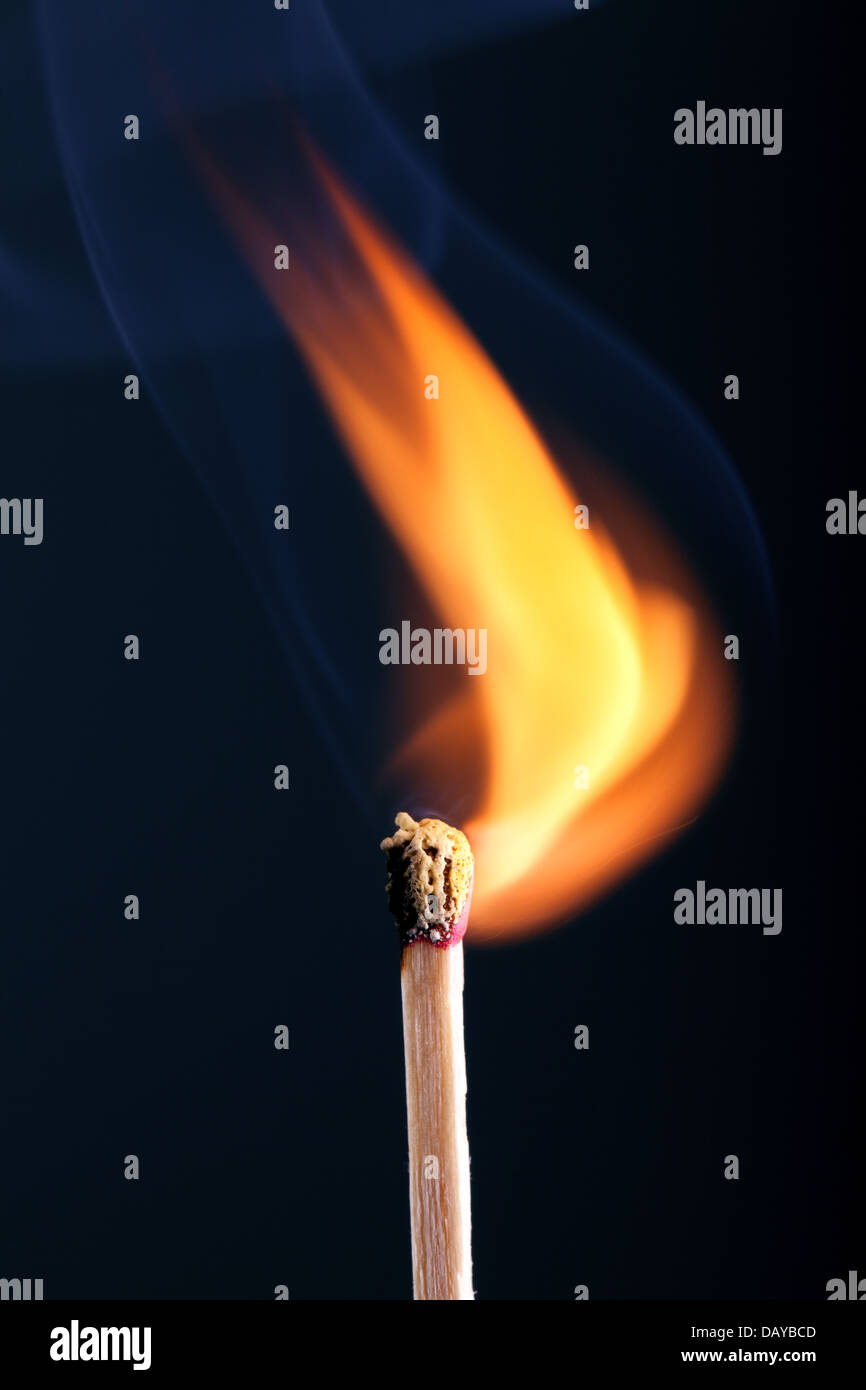Ignition of a match, with smoke on dark background Stock Photo - Alamy