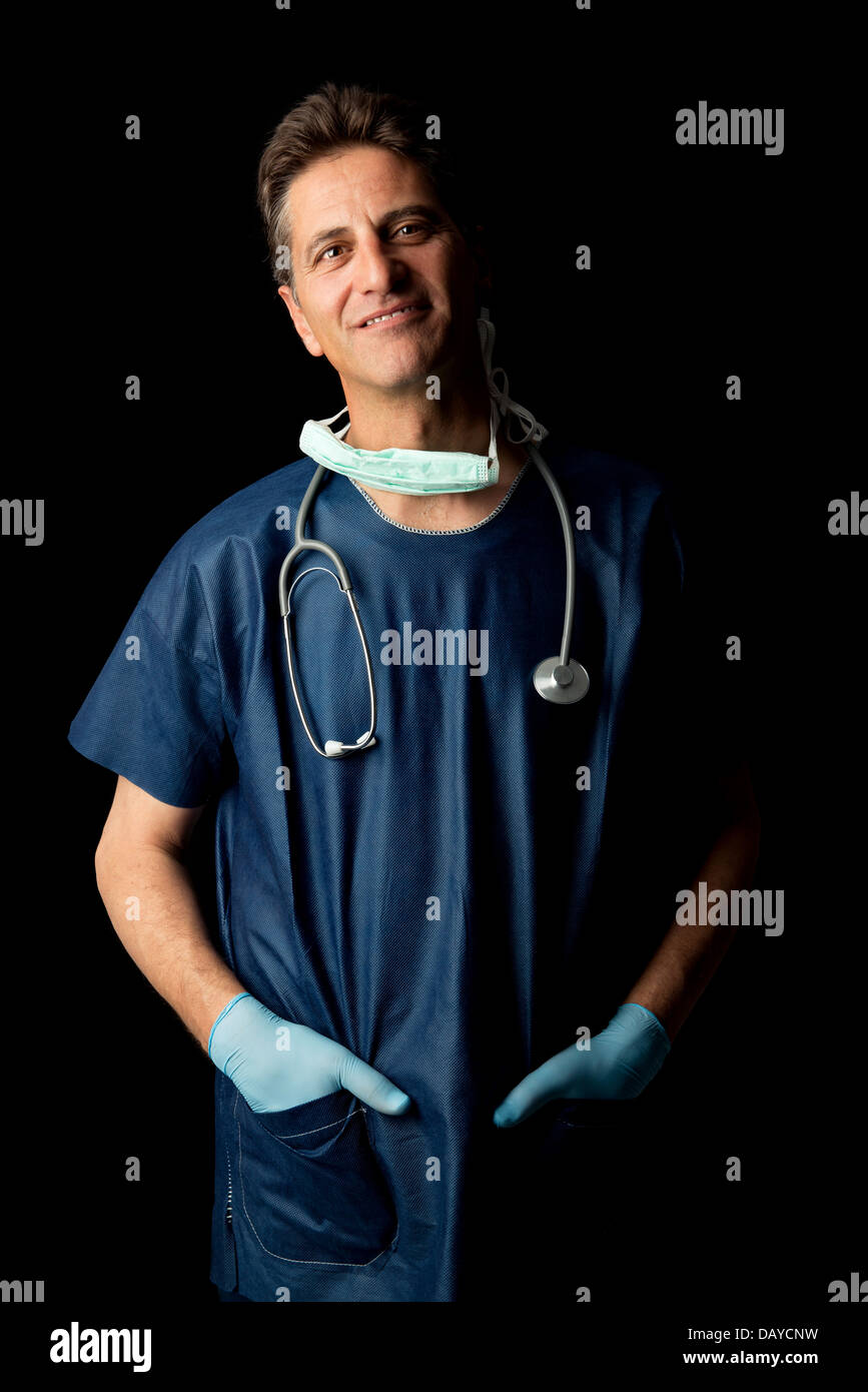 Doctor in uniform isolated against a black background Stock Photo - Alamy