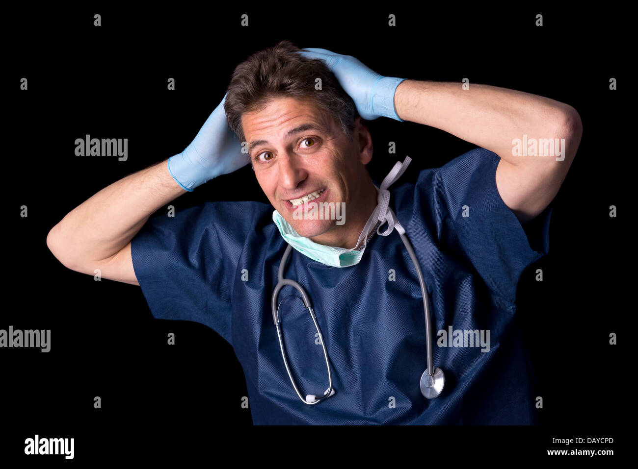 Stressed doctor in uniform isolated against a black background Stock ...