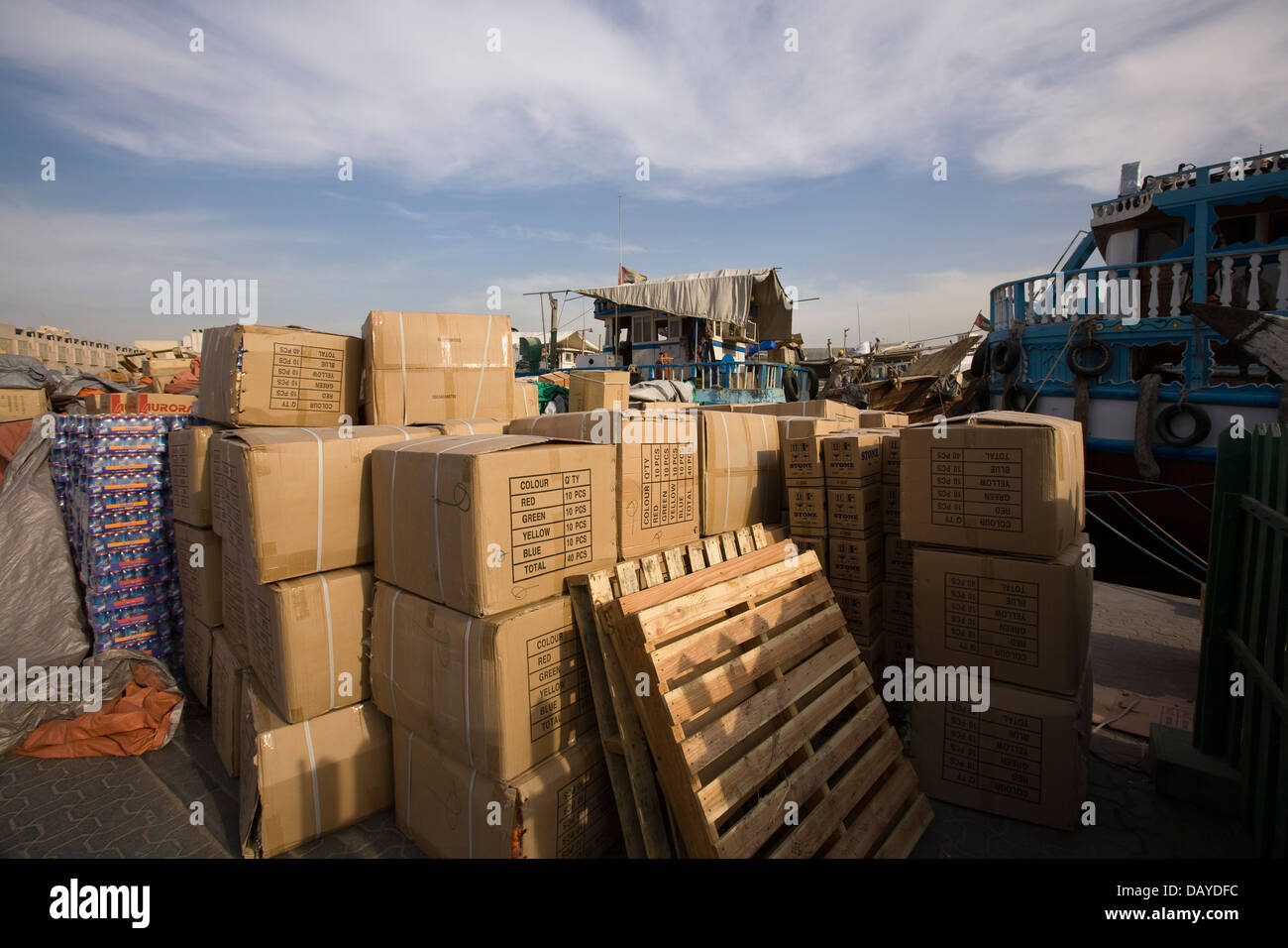 Goods being unloaded and loaded for transport, Dubai, United Arab ...