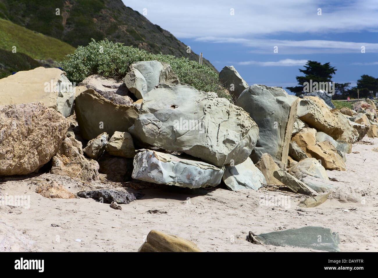 Limestone boulders on the beach in Ventura near the mountain, CA Stock ...