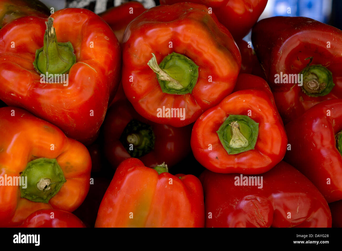 A stack of red peppers on a market stall Stock Photo - Alamy