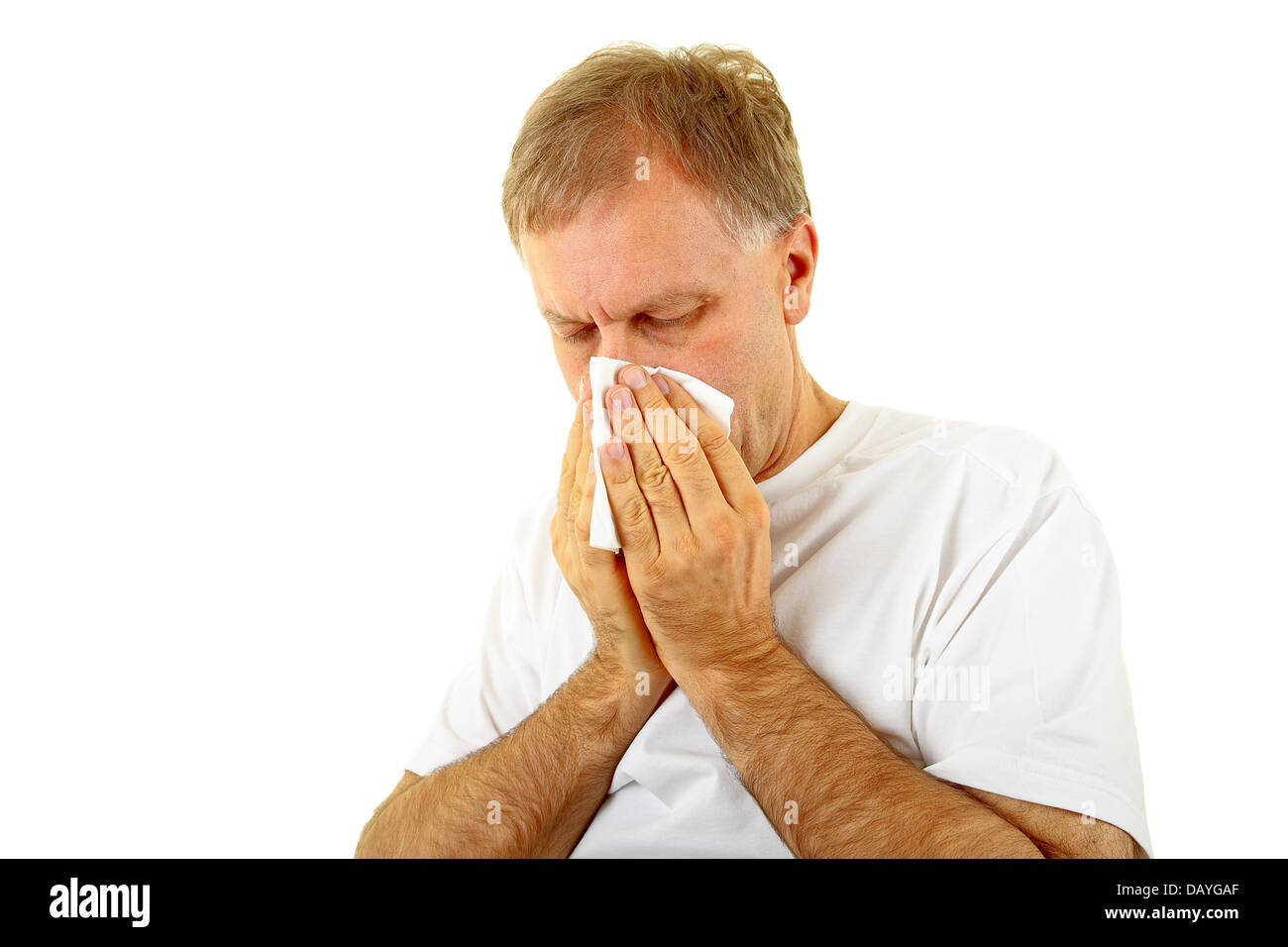 Portrait of sneezing man Stock Photo - Alamy