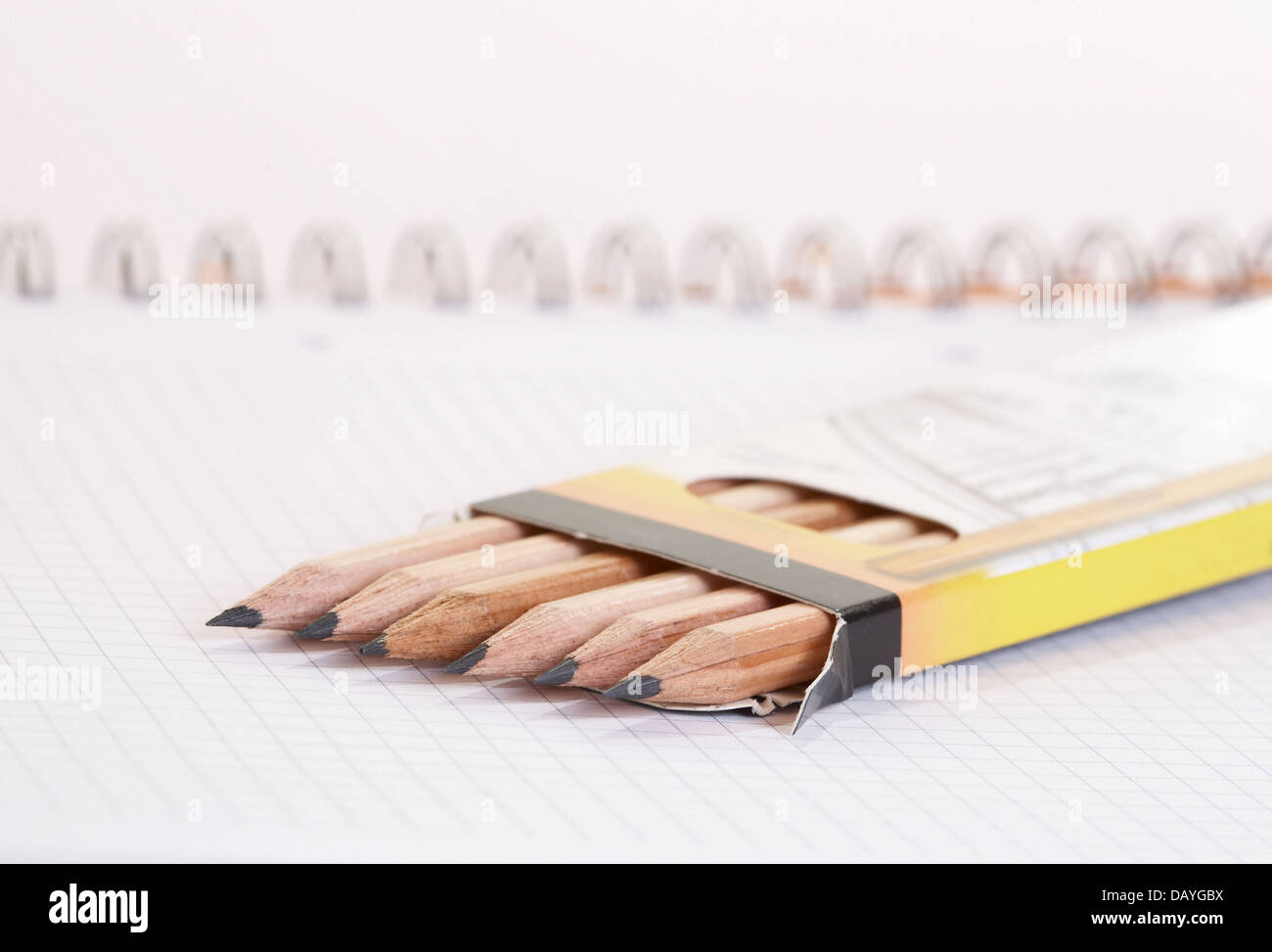 line pencils in a box on sheet of notebook Stock Photo - Alamy