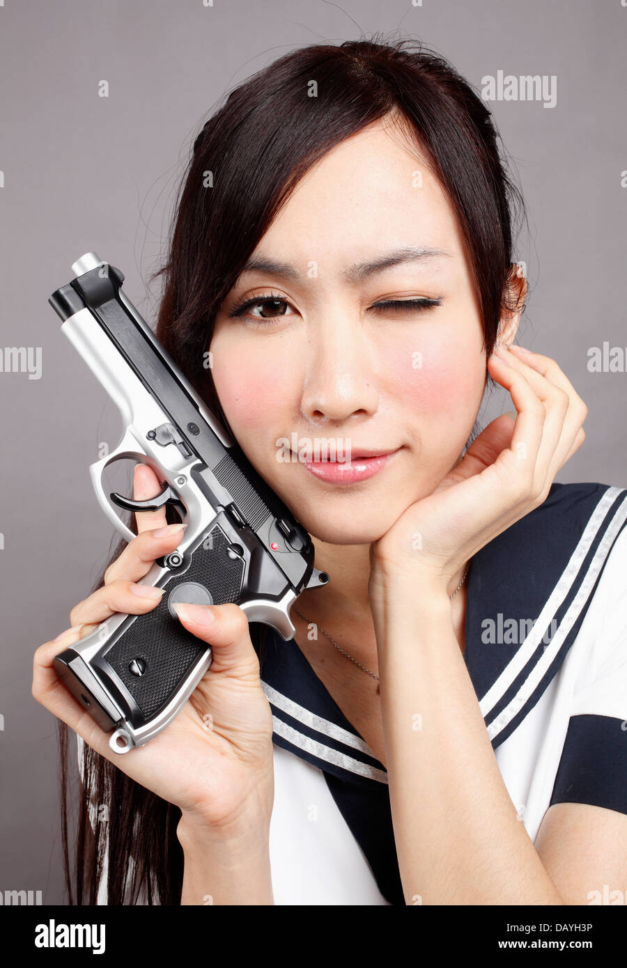 School girl plays gun Stock Photo - Alamy