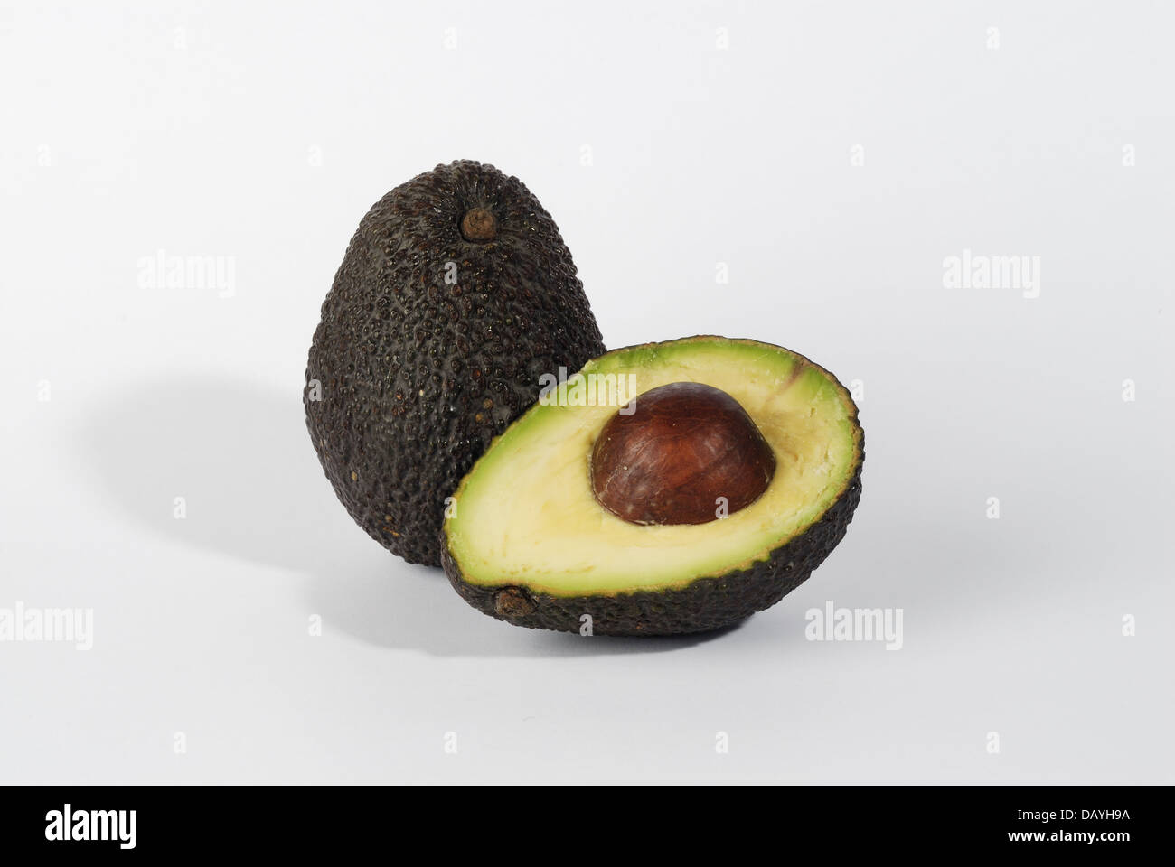 Avocado and half open Stock Photo - Alamy