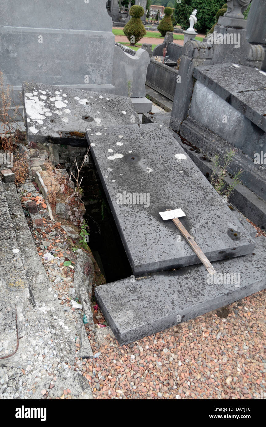 A damaged and spookily open grave in the Beauval Communal Cemetery ...