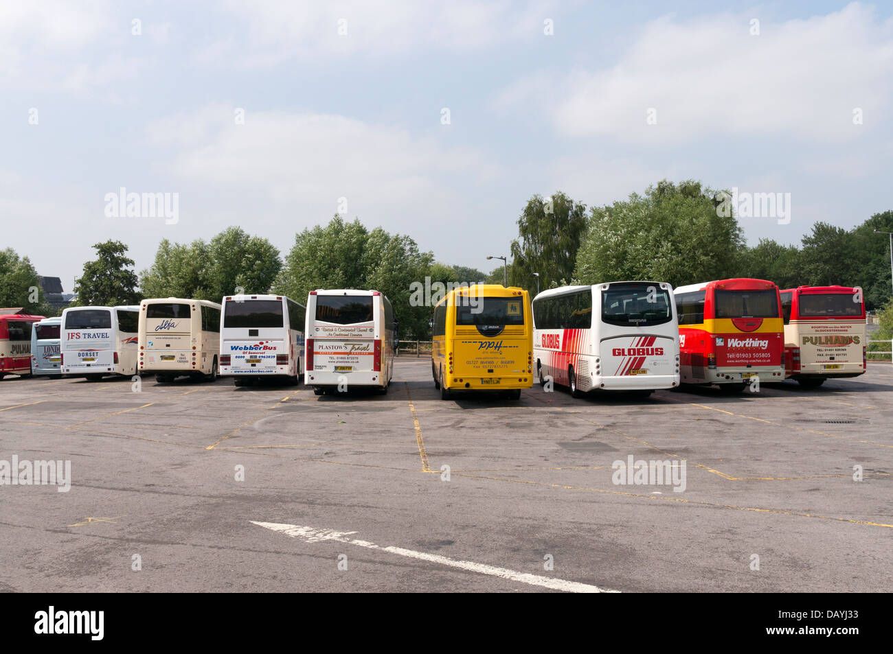 Rear view of tour coaches parked in UK coach park Stock Photo - Alamy