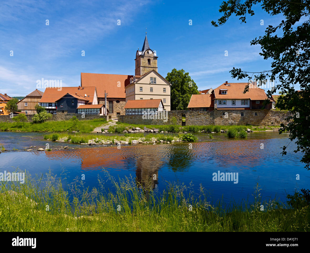 Church of St. Bartholomew with town wall and Werra river, Themar ...