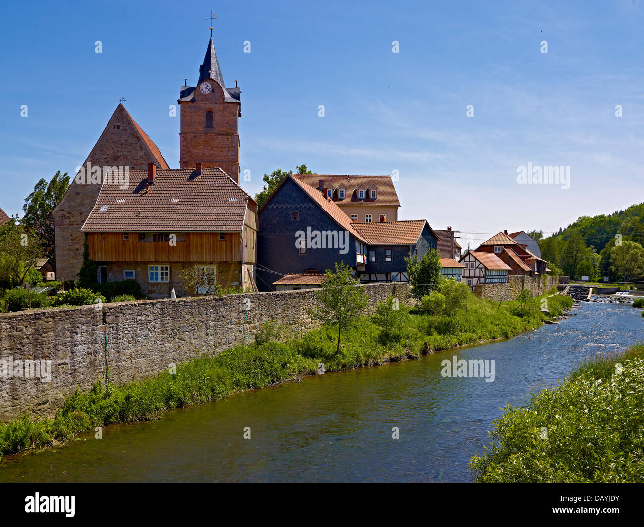 Church of St. Bartholomew with town wall and Werra river, Themar ...
