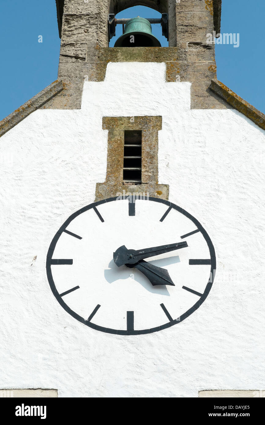 Old black clock face on the white painted wall of St Johns Church in ...