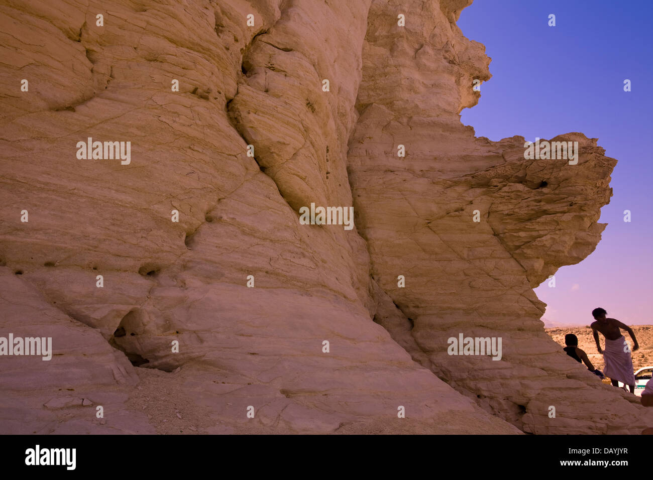 Limestone sea cliffs border scenic Fins Beach, near the village of Tiwi ...