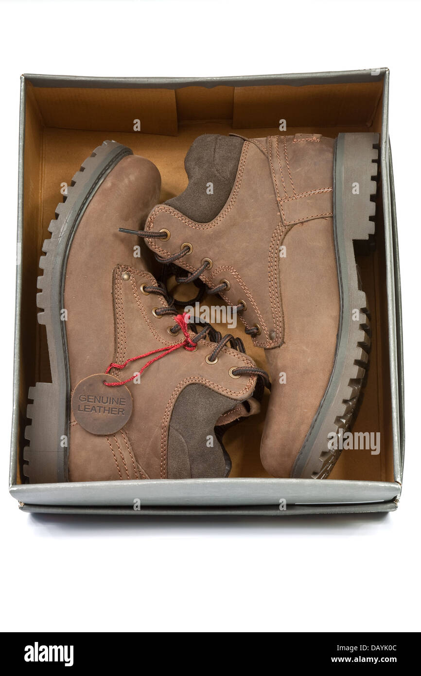 Mens brown leather boots with a red label strings Stock Photo - Alamy